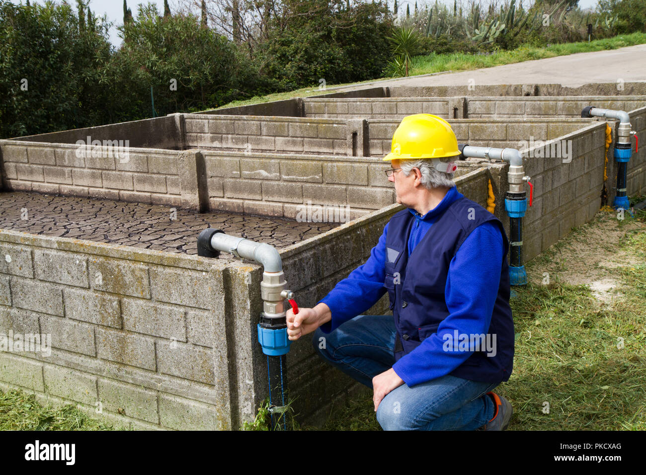 plumber at work in wastewater treatment plant Stock Photo - Alamy