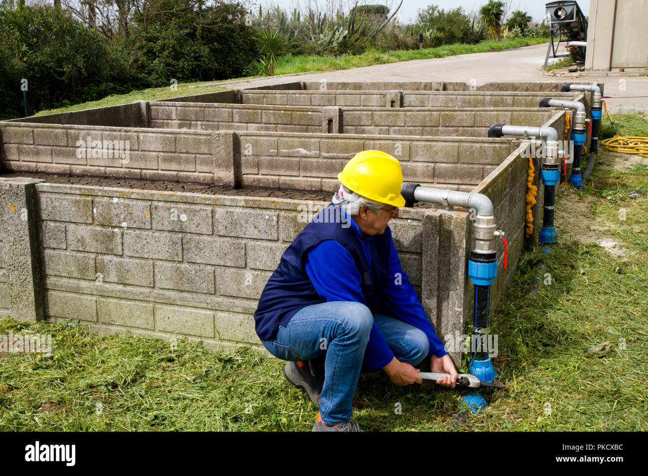 plumber at work in wastewater treatment plant Stock Photo - Alamy