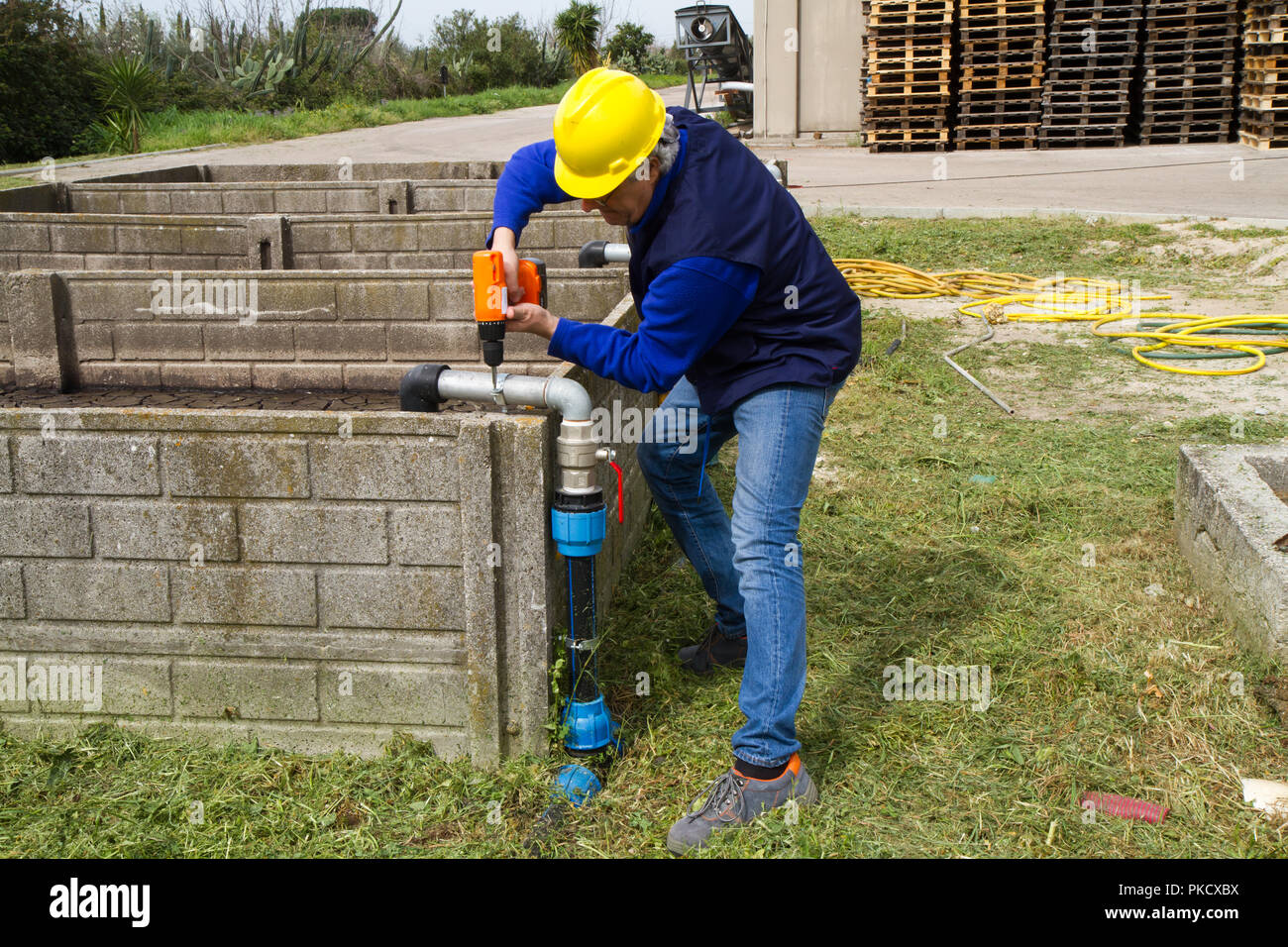 plumber at work in wastewater treatment plant Stock Photo - Alamy