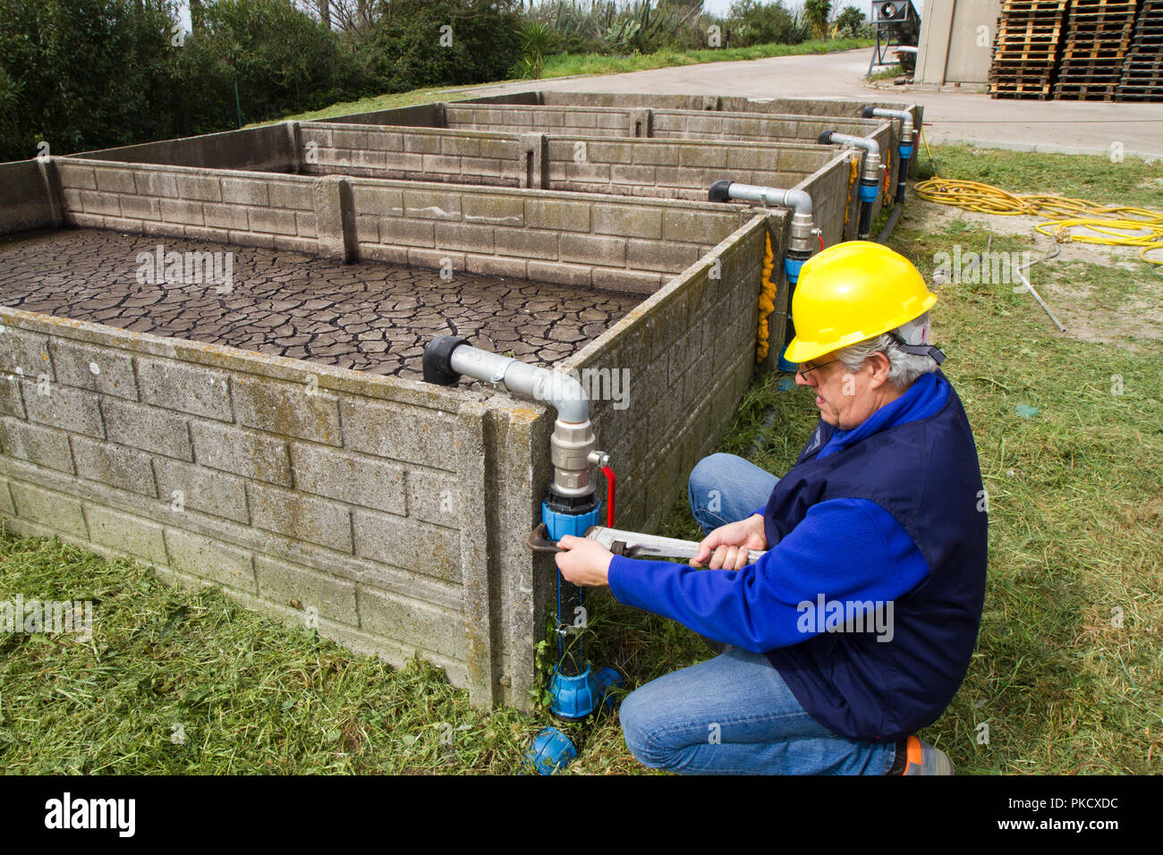 plumber at work in wastewater treatment plant Stock Photo - Alamy