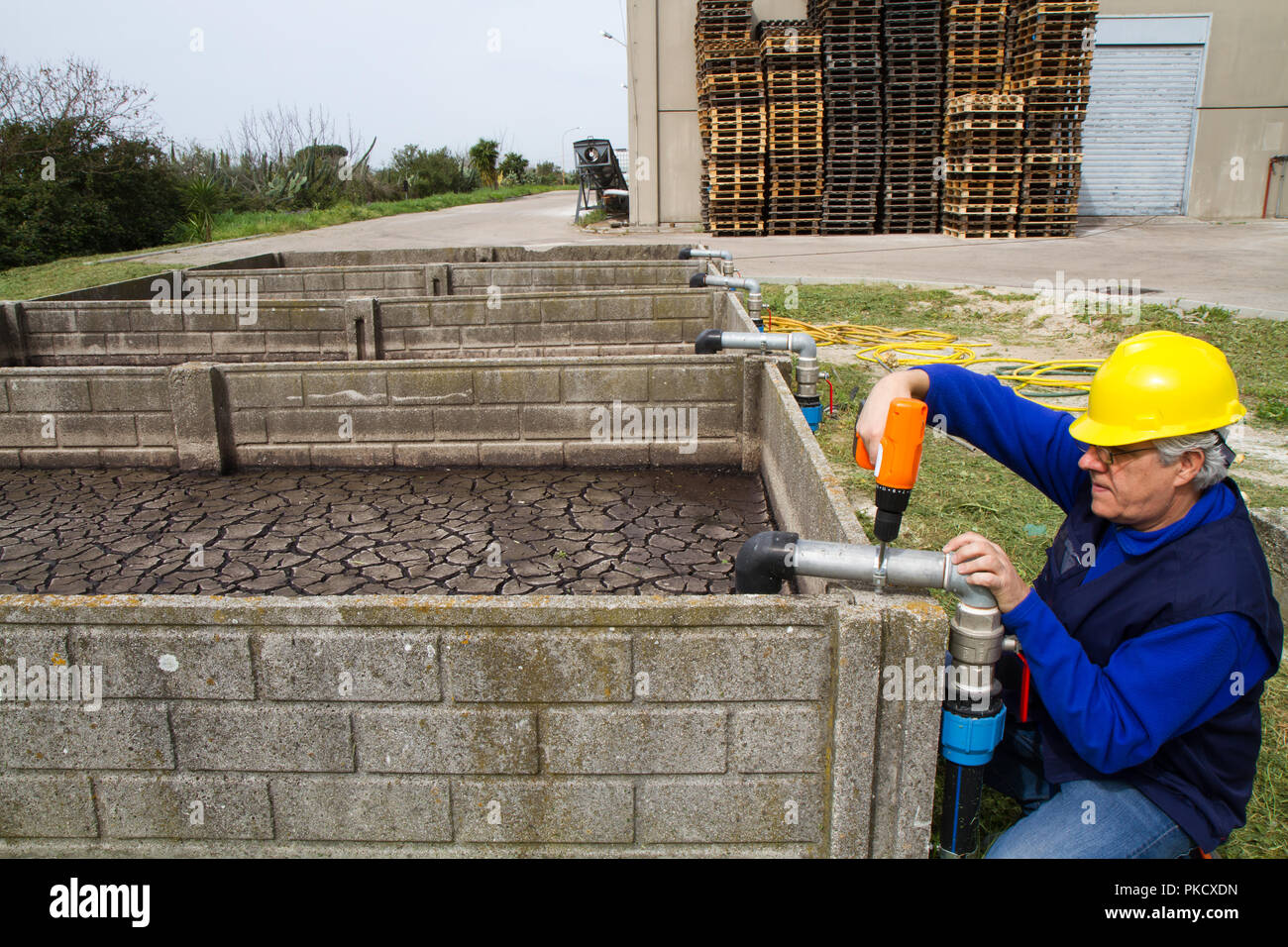 plumber at work in wastewater treatment plant Stock Photo - Alamy