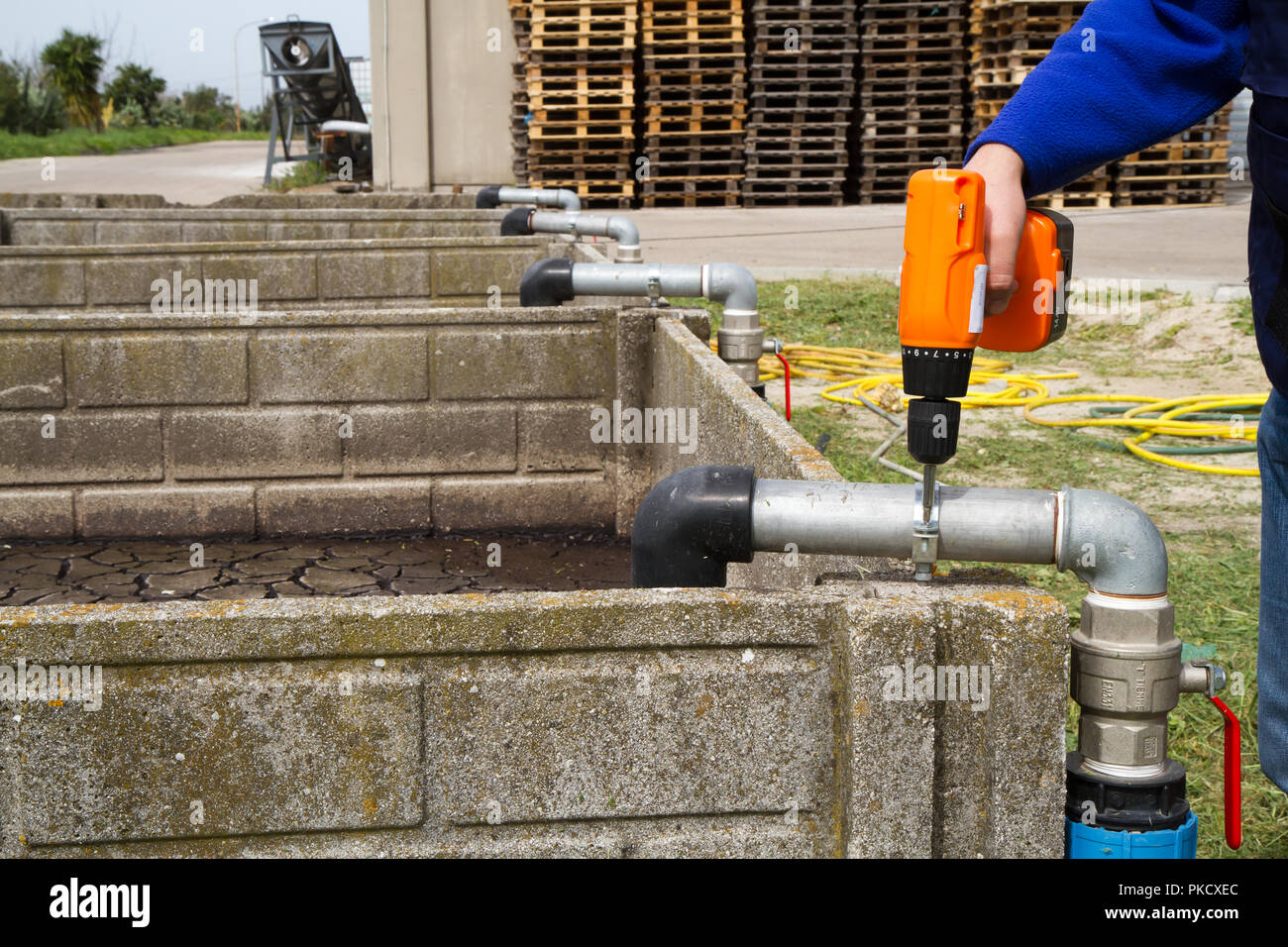 plumber at work in wastewater treatment plant Stock Photo - Alamy