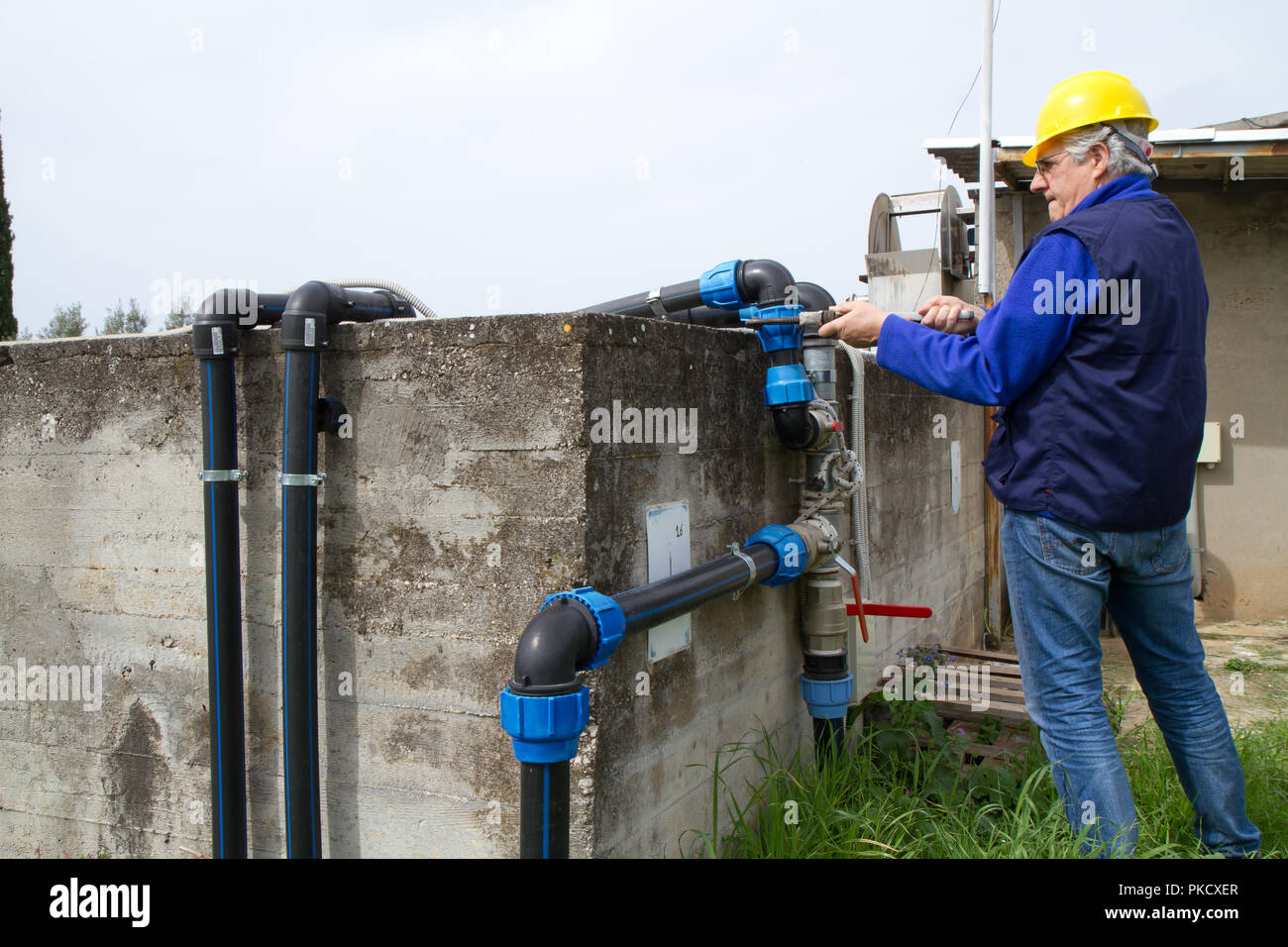 plumber at work in wastewater treatment plant Stock Photo - Alamy