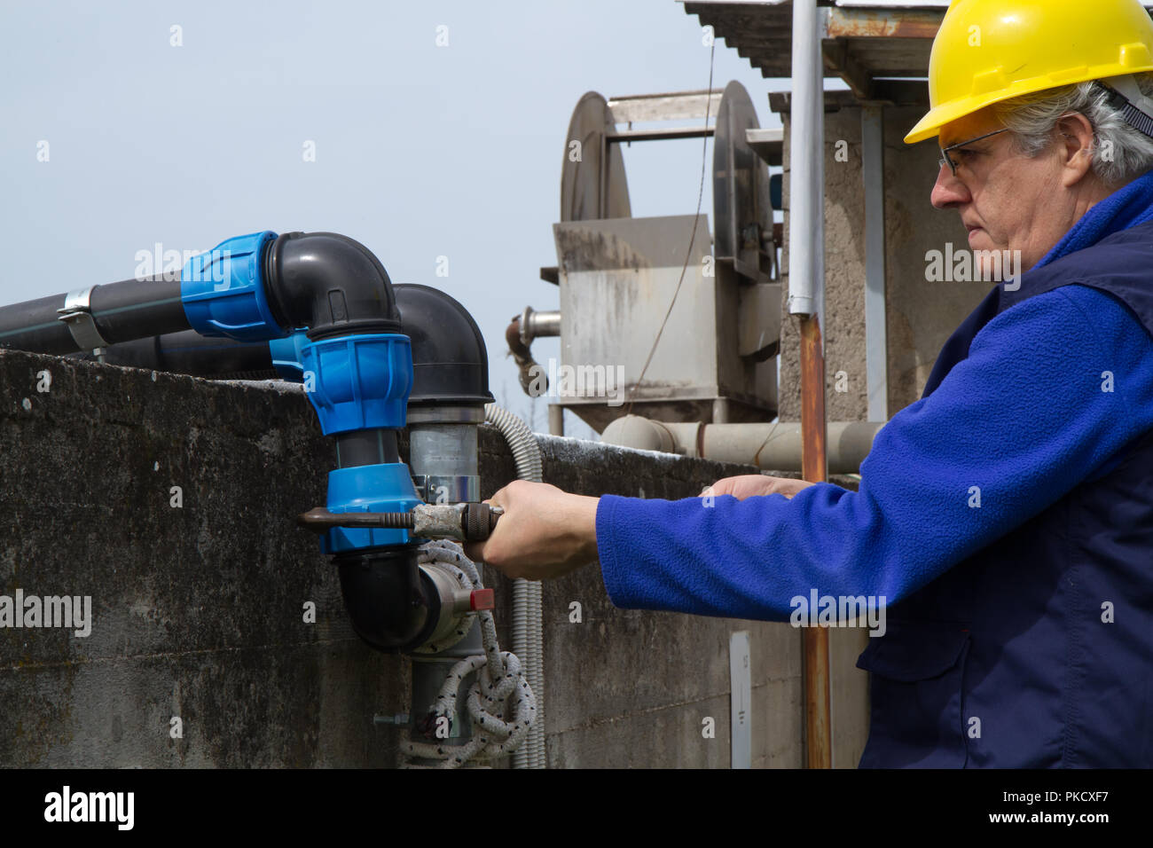 Worker installing wastewater plumbing hi-res stock photography and ...