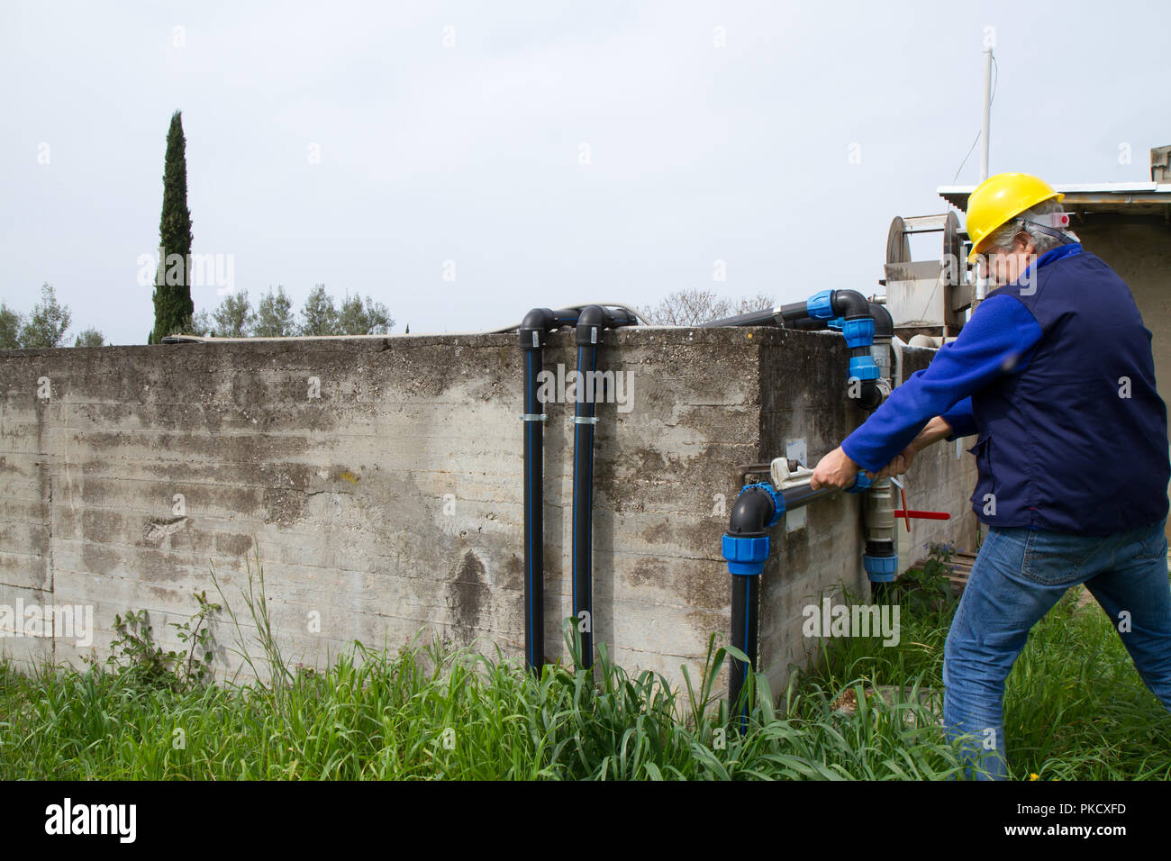 plumber at work in wastewater treatment plant Stock Photo - Alamy