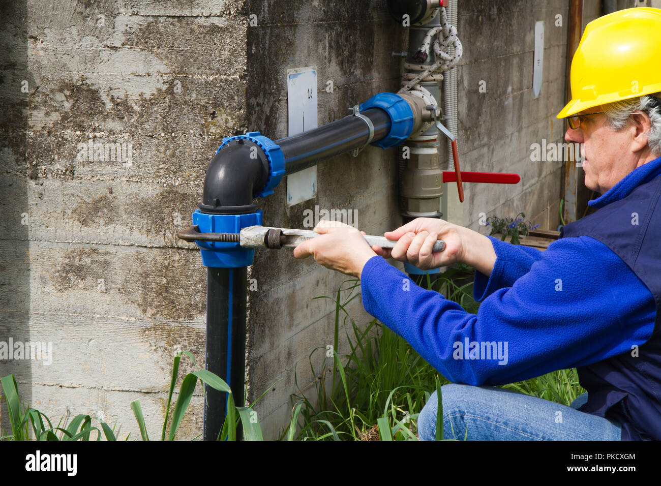 plumber at work in wastewater treatment plant Stock Photo - Alamy