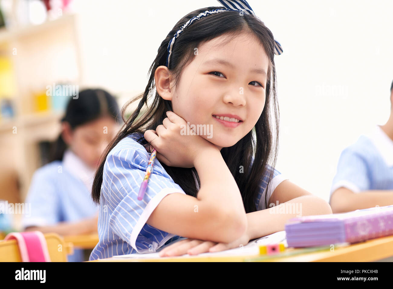 Primary school girls in the classroom Stock Photo - Alamy