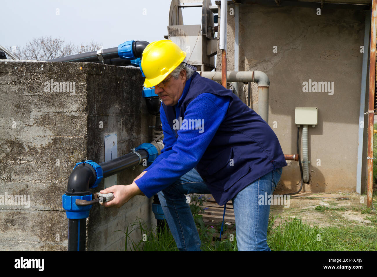plumber at work in wastewater treatment plant Stock Photo - Alamy