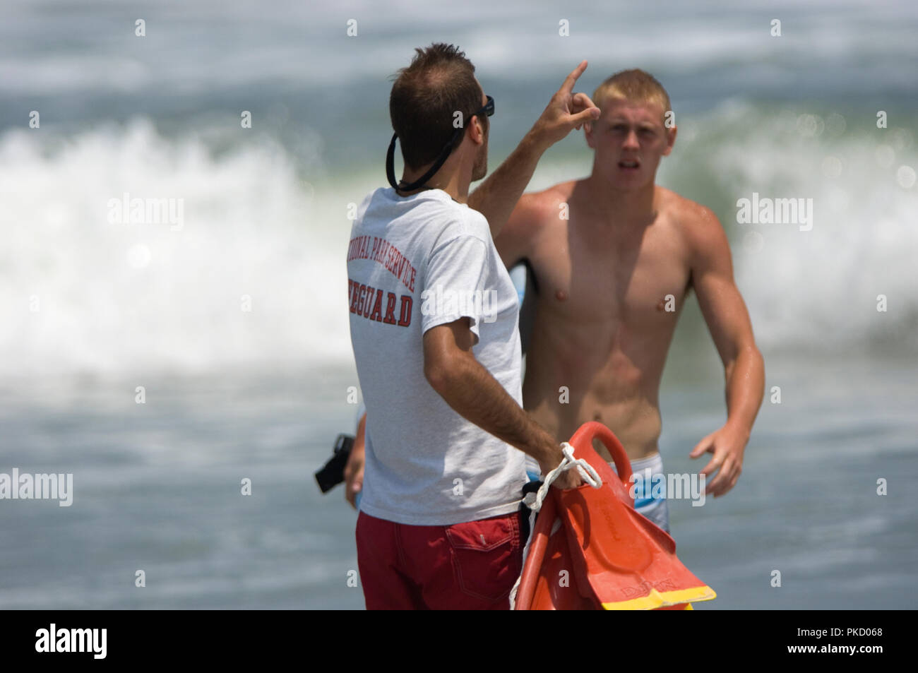 U.S. Park Service life guard warns swimmers of rip-tides in the public ...