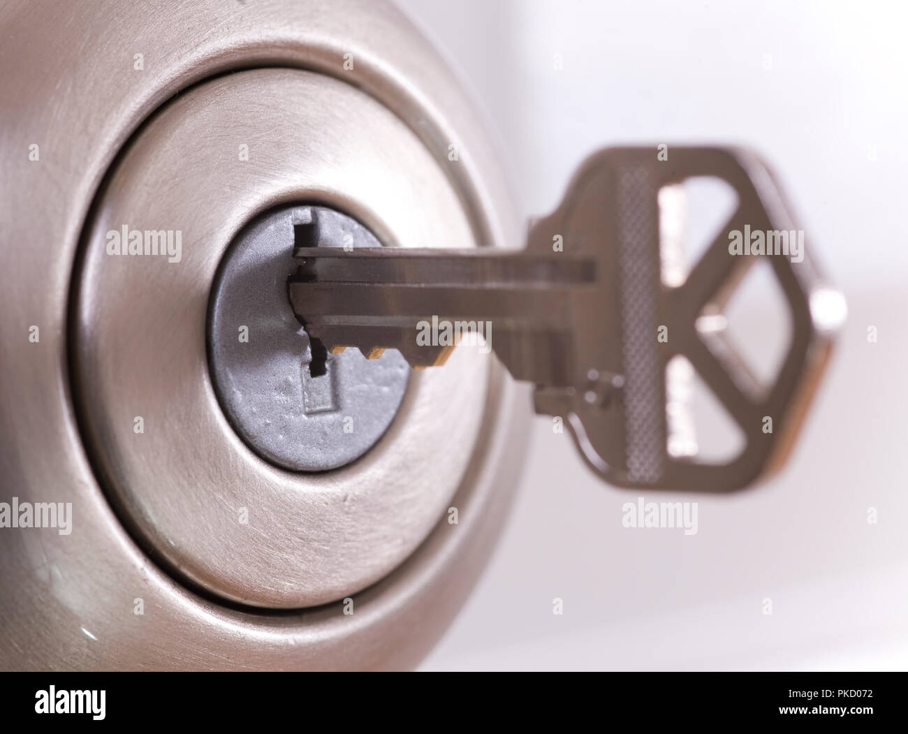 key and lock in the door close up Stock Photo - Alamy