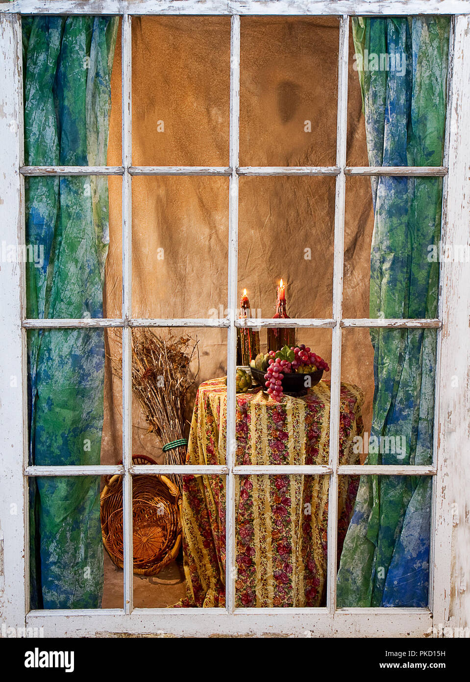 View through old weathered window-panes of quaint home with curtains ...