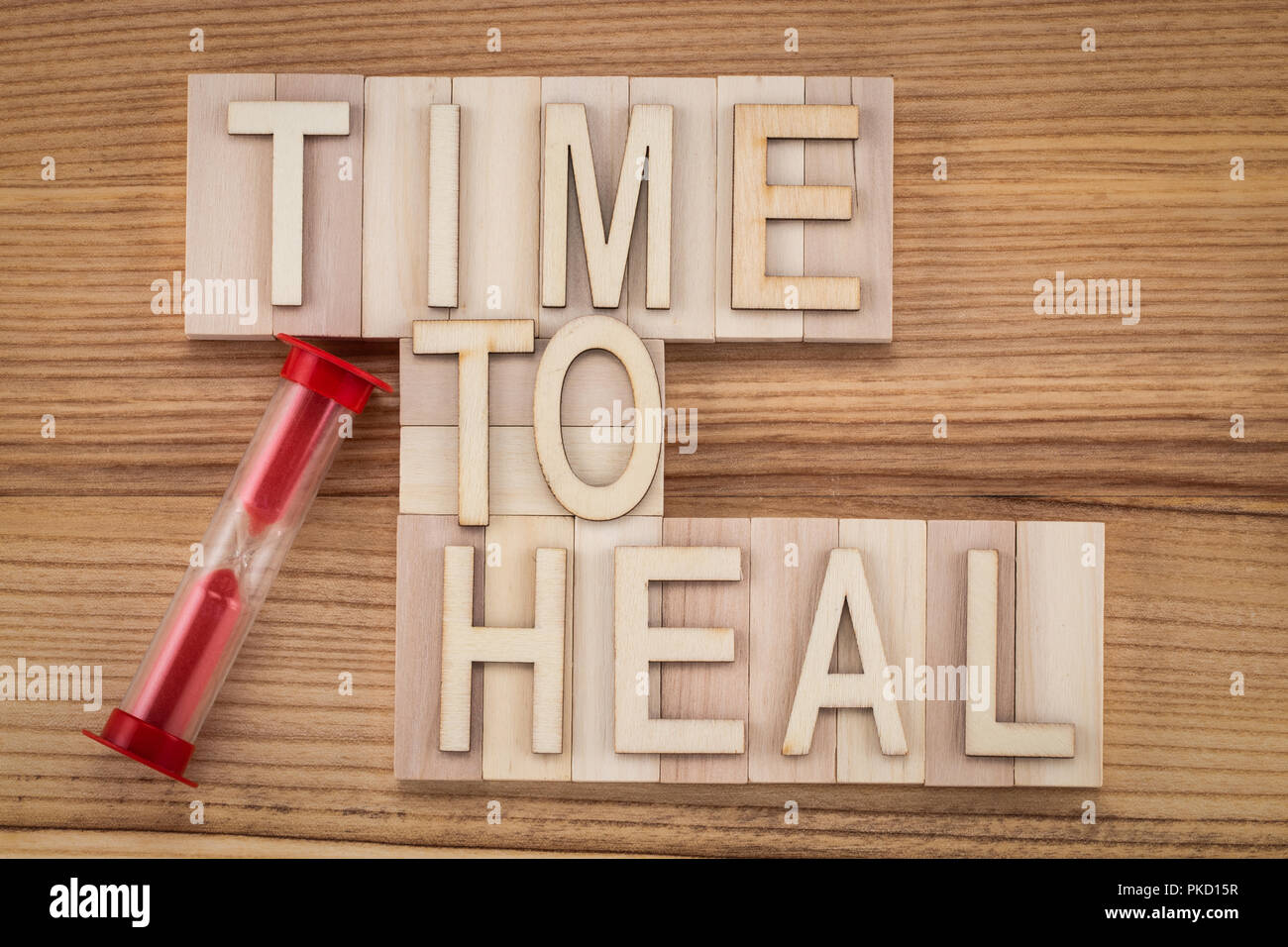 time to heal- text in vintage letters on wooden blocks. Medicine ...