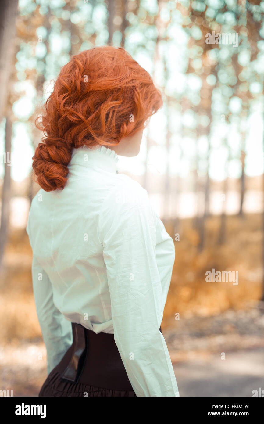 Victorian woman standing in forest Stock Photo - Alamy