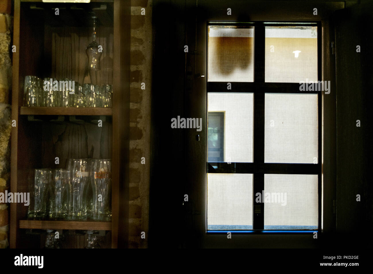 window of a pub photographed taken against the light Stock Photo - Alamy