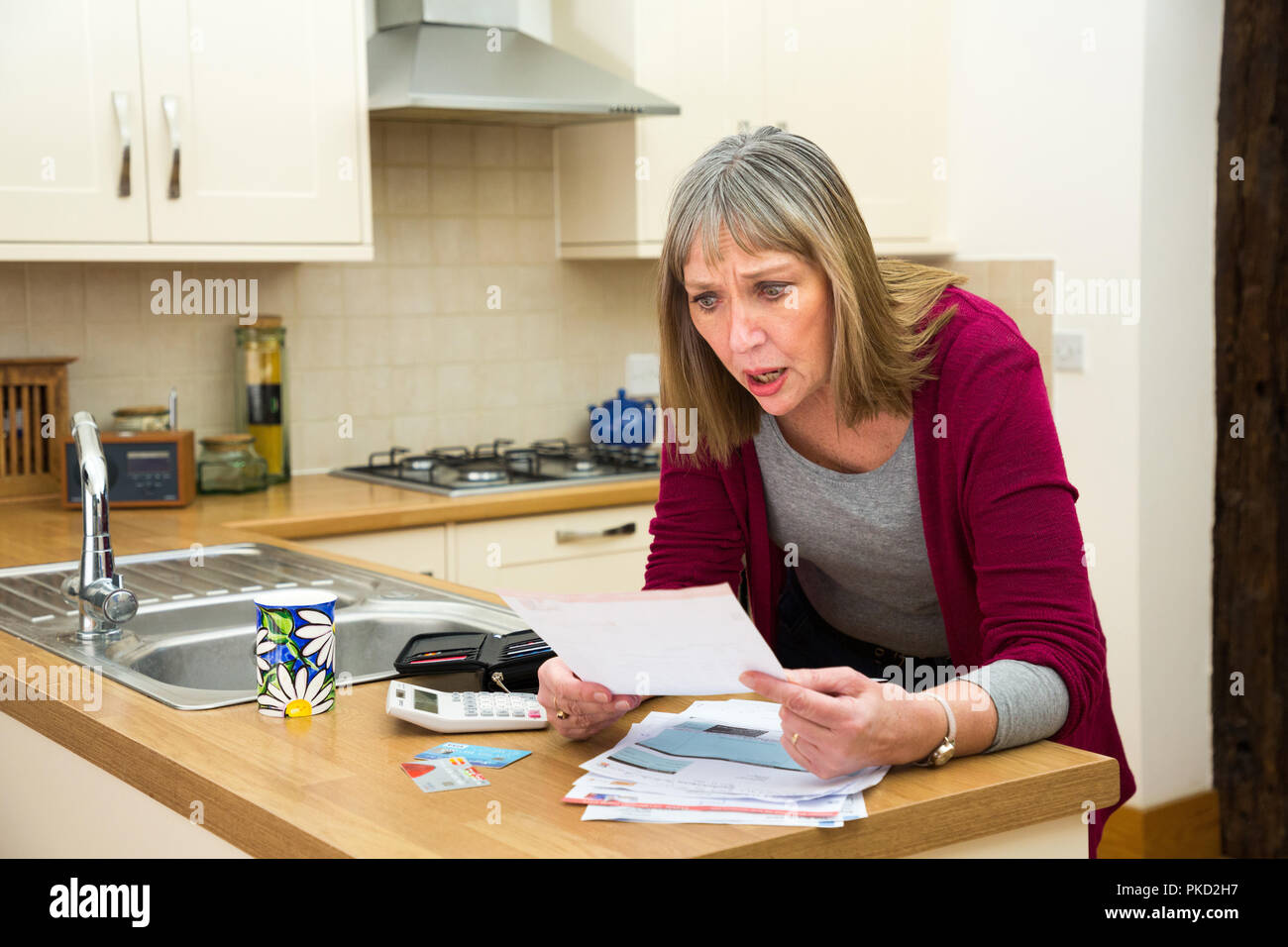 Woman bank statement worried hi-res stock photography and images - Alamy