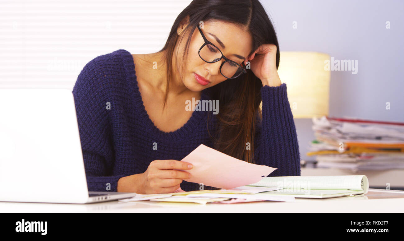 Japanese woman doing taxes Stock Photo - Alamy