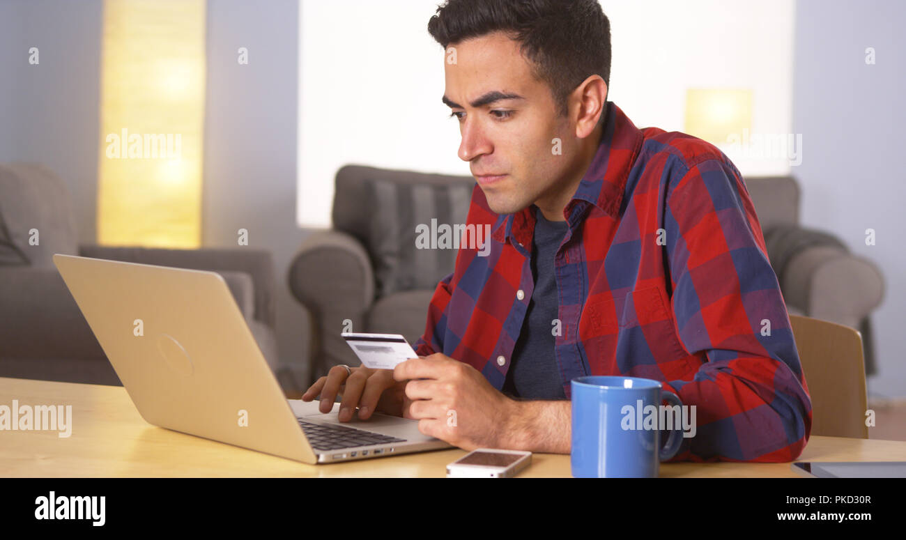 Mexican man using credit card online Stock Photo - Alamy