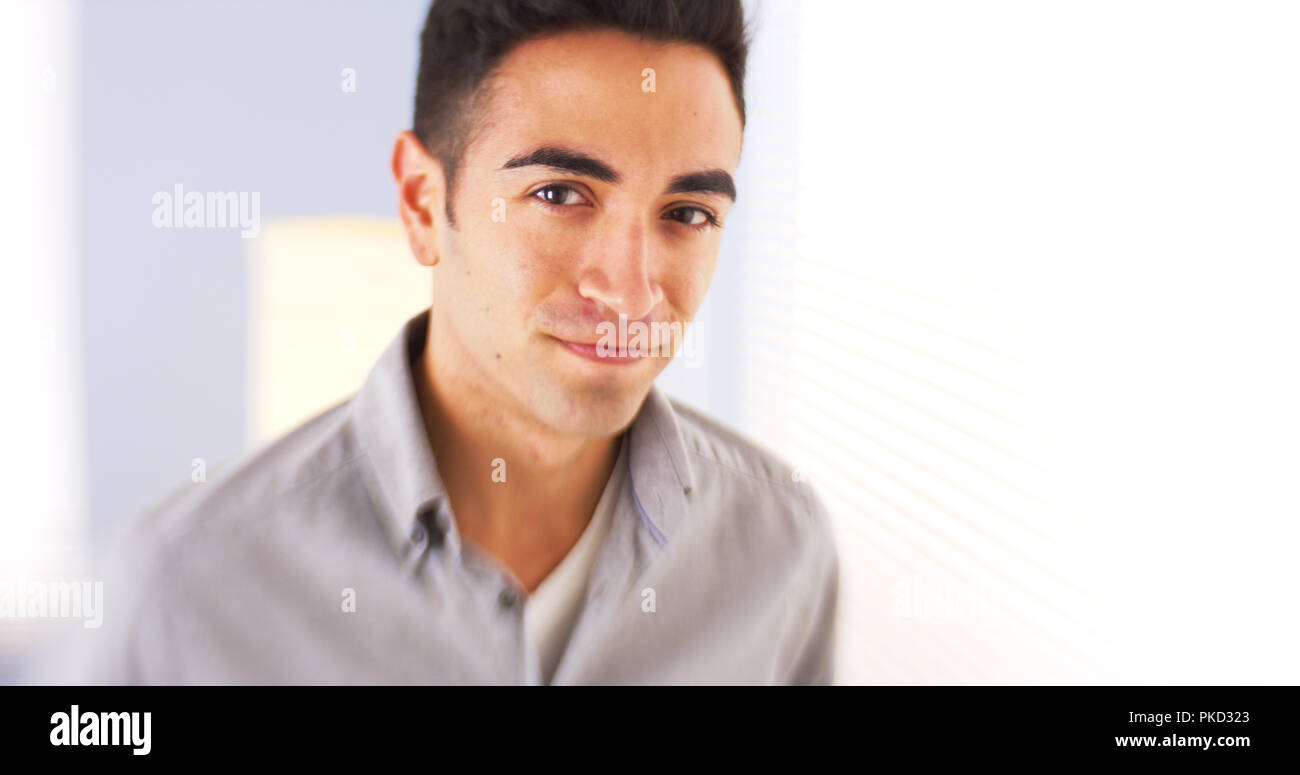 Confident mexican man standing window hi-res stock photography and ...