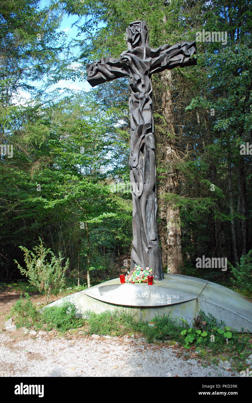 A carved wooden memorial cross dedicated to those executed by Tito's ...