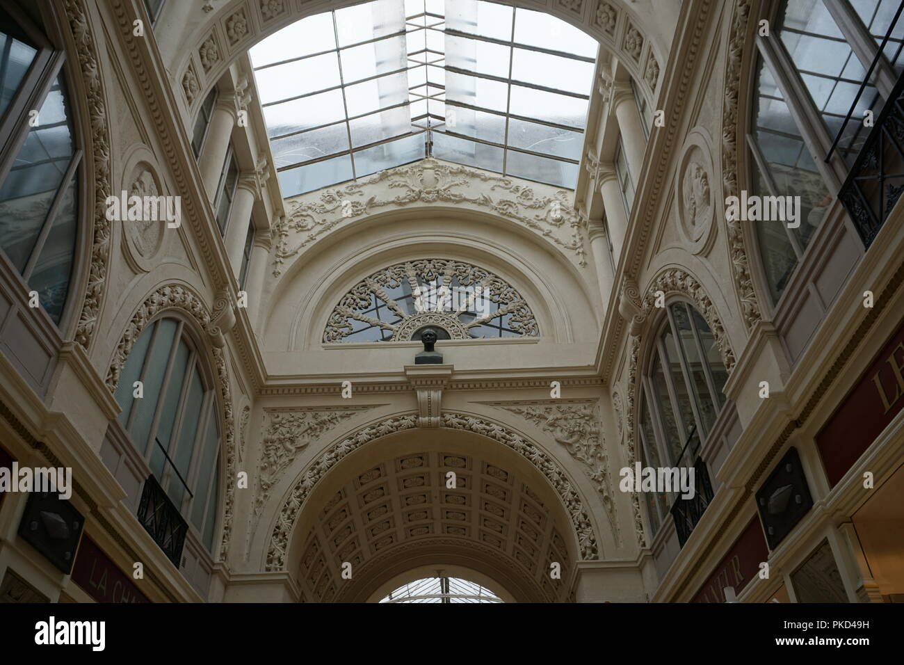 The inside high windows and glass roof of an indoor gallery in the city ...