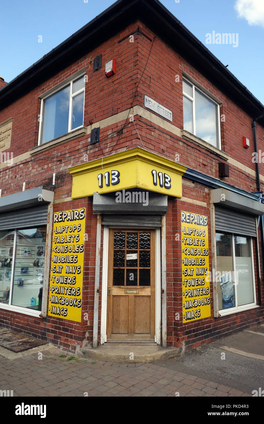 Shop front on a corner is an English Computer repair shop Stock Photo ...