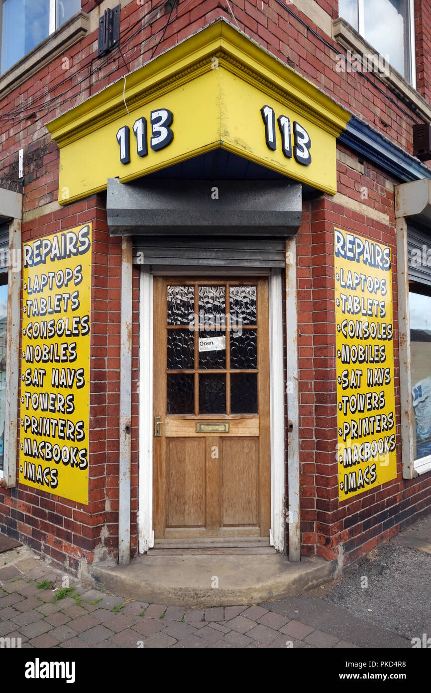 Shop front on a corner is an English Computer repair shop Stock Photo ...