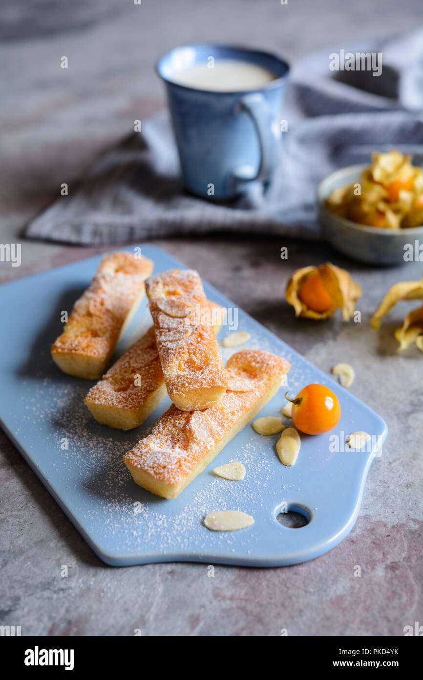 Traditional Financier biscuits with Physalis and almond flakes Stock ...