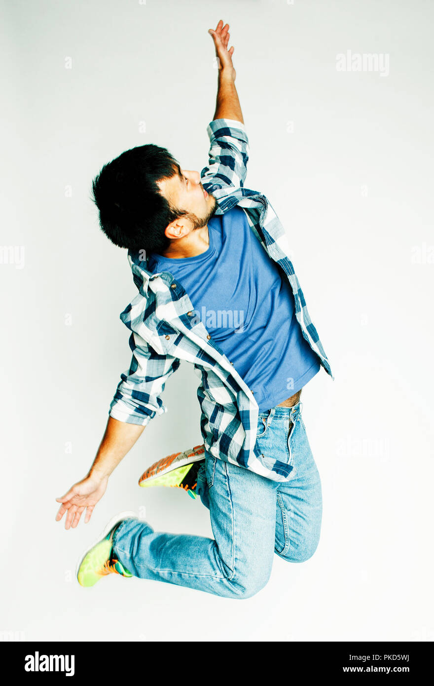 young pretty asian man jumping cheerful against white background Stock ...