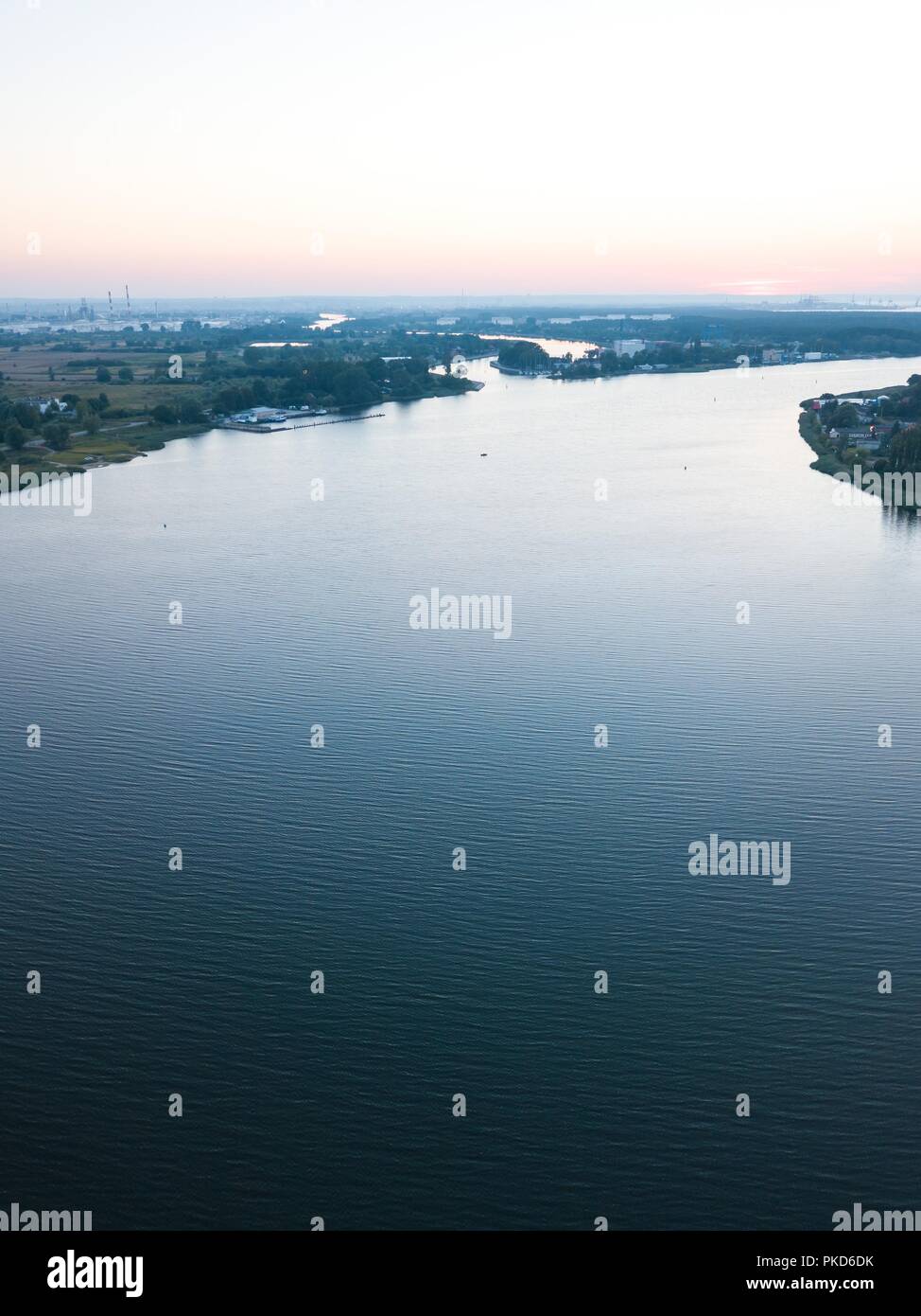 Beautiful sunset over estuary of Vistula river in Gdansk. Summer sunset ...
