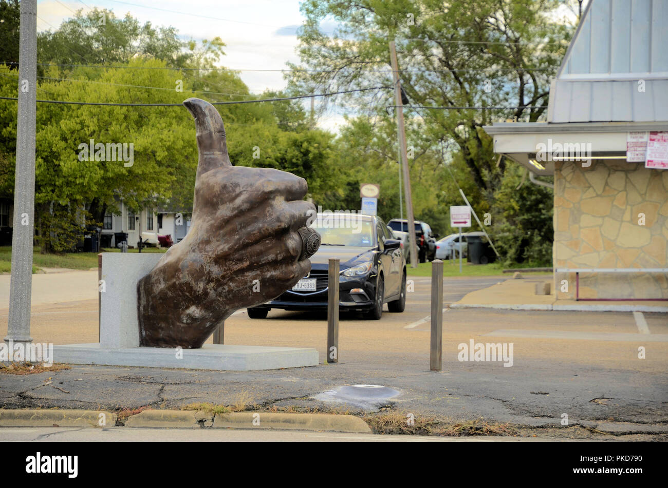 Bronze "Gig 'Em" statue in College Station, Texas, USA Stock Photo - Alamy