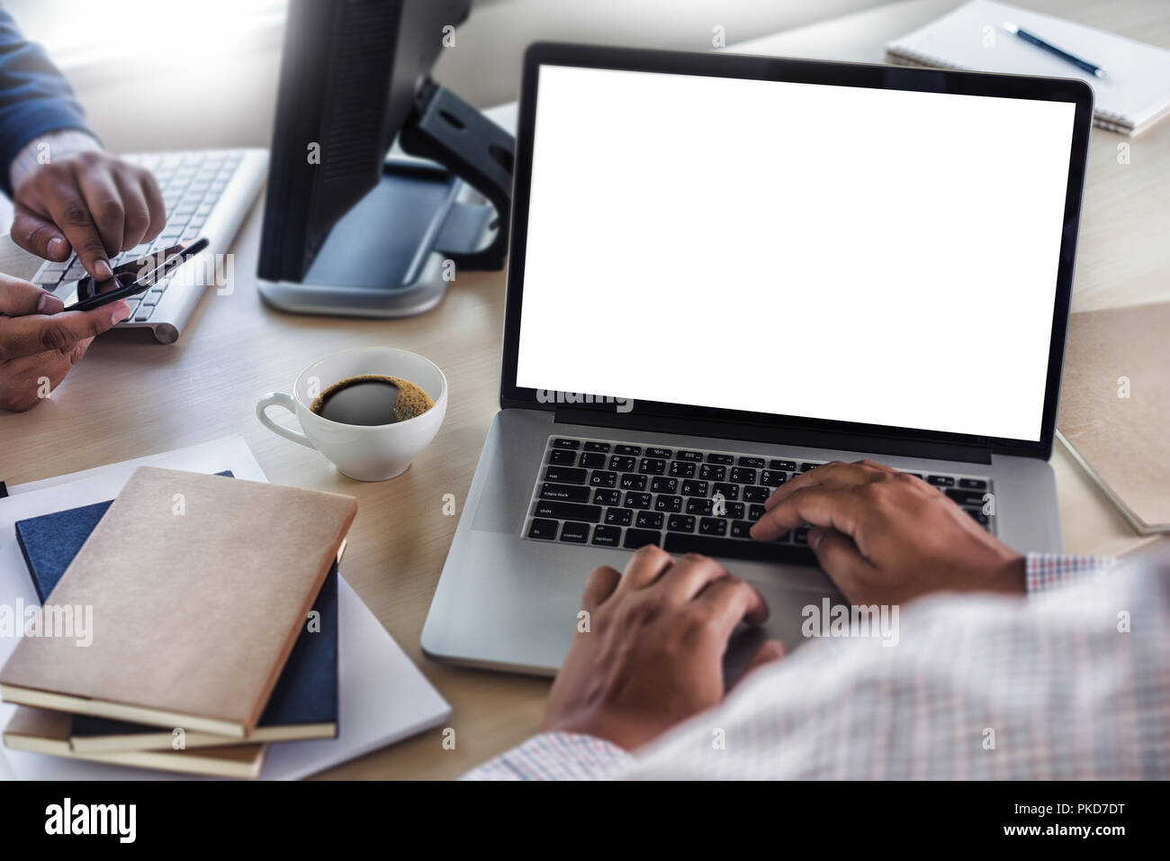 man of business man hand working on laptop computer blank white screen ...