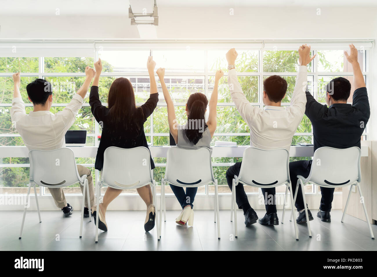 Businessman rising hands hi-res stock photography and images - Alamy