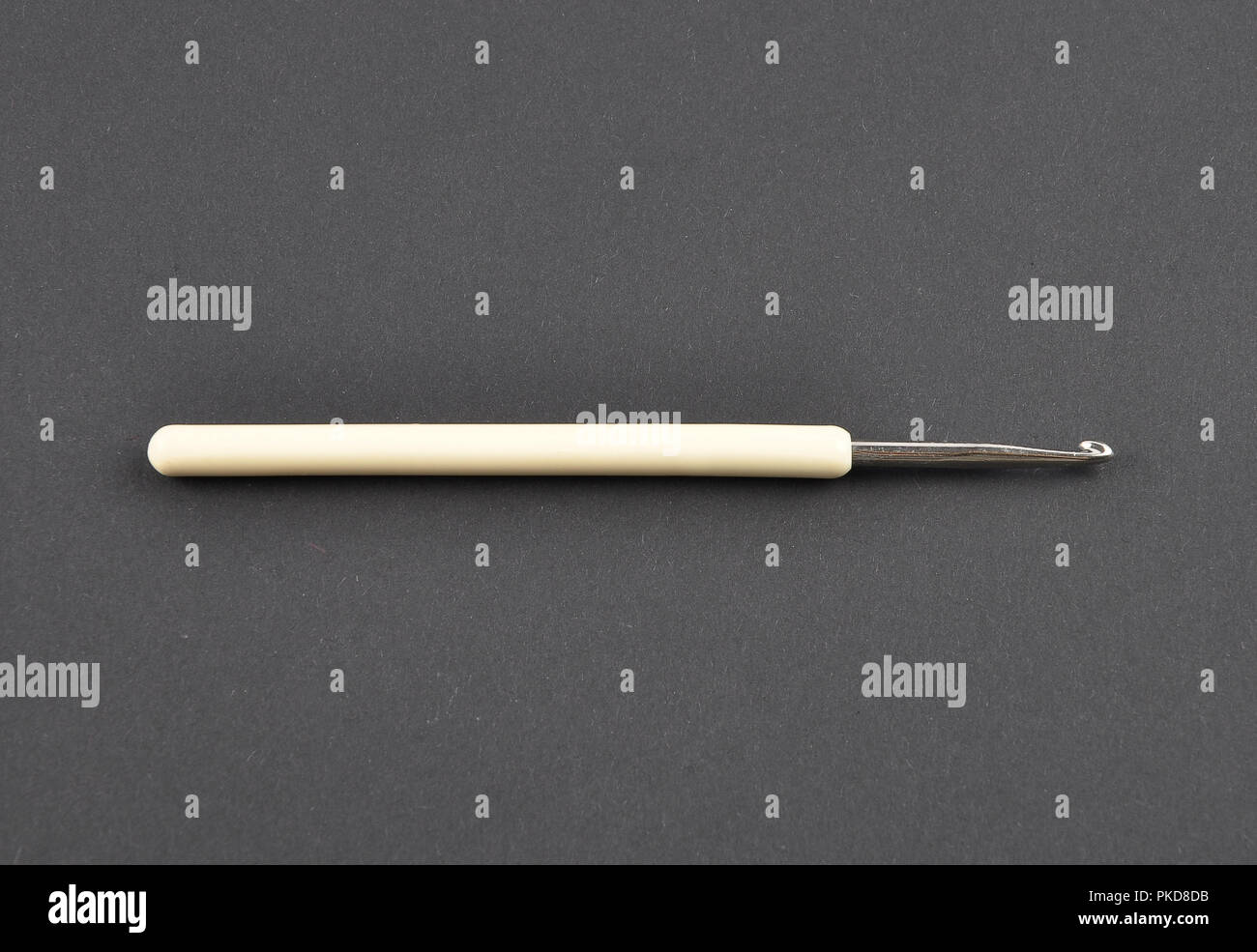 Crochet hook on black background Stock Photo - Alamy