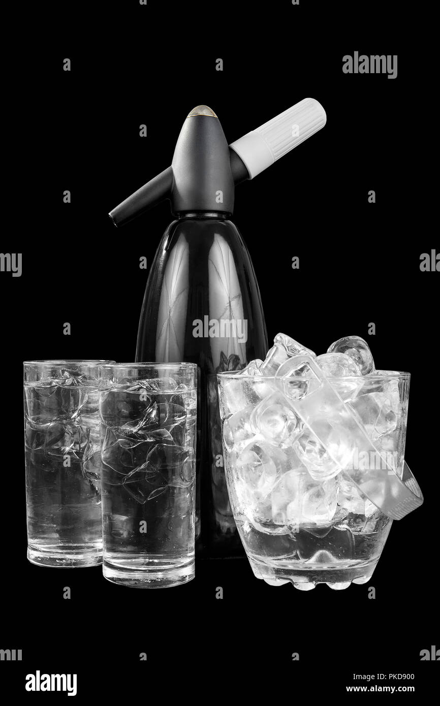 Black shiny metal table siphon for soda, next to a transparent bucket ...