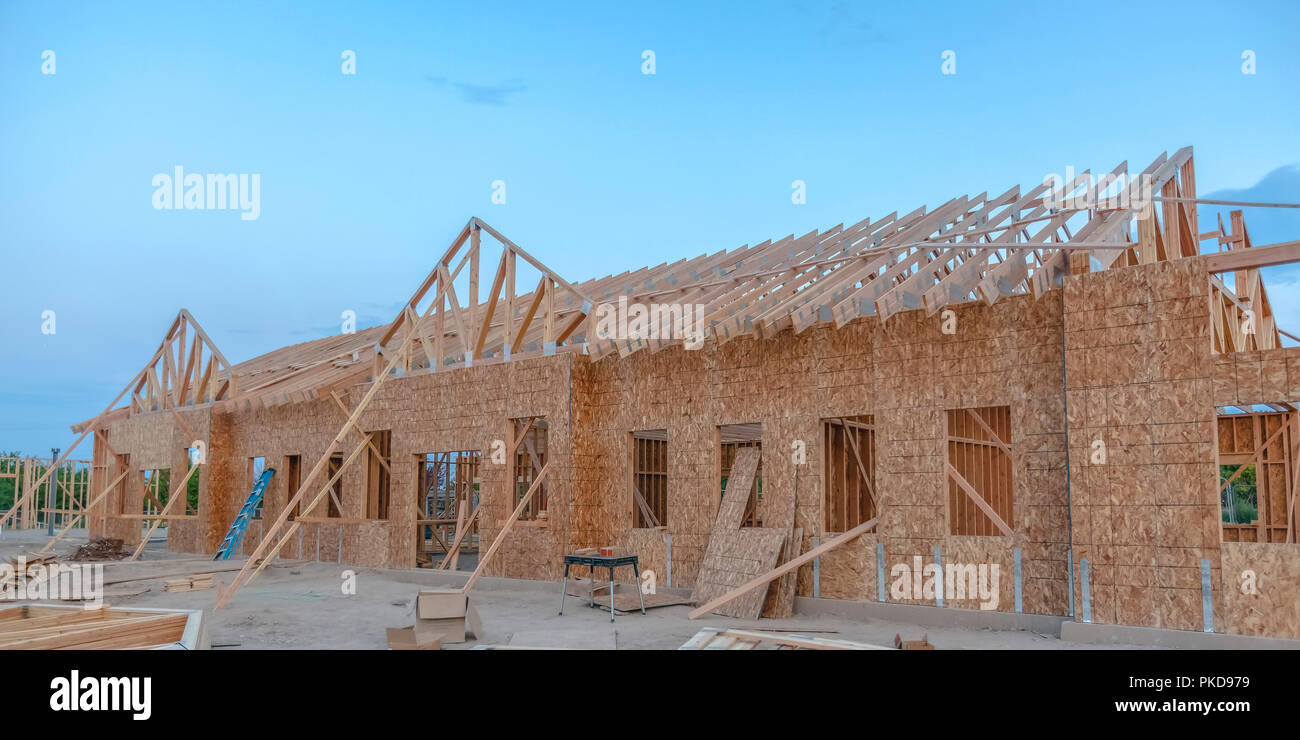 A new building under construction exterior pano Stock Photo - Alamy