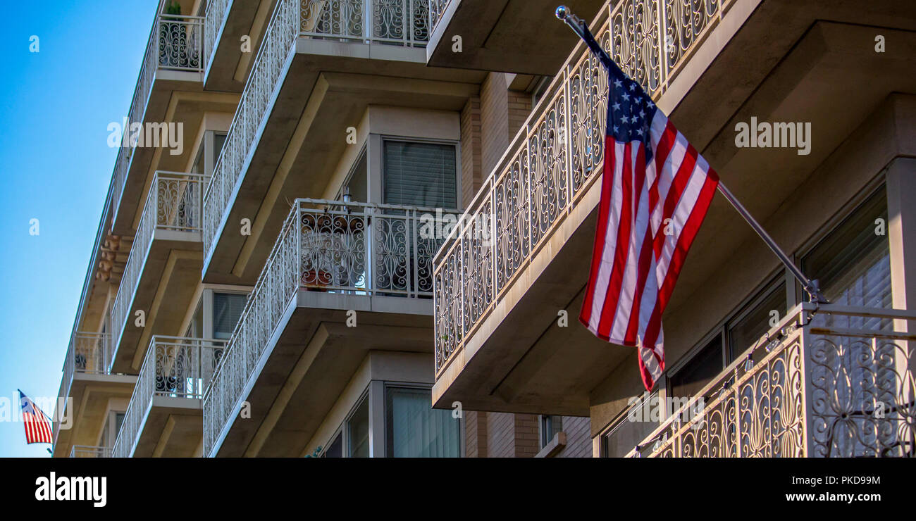 American Flag on the balcony of a building Stock Photo - Alamy