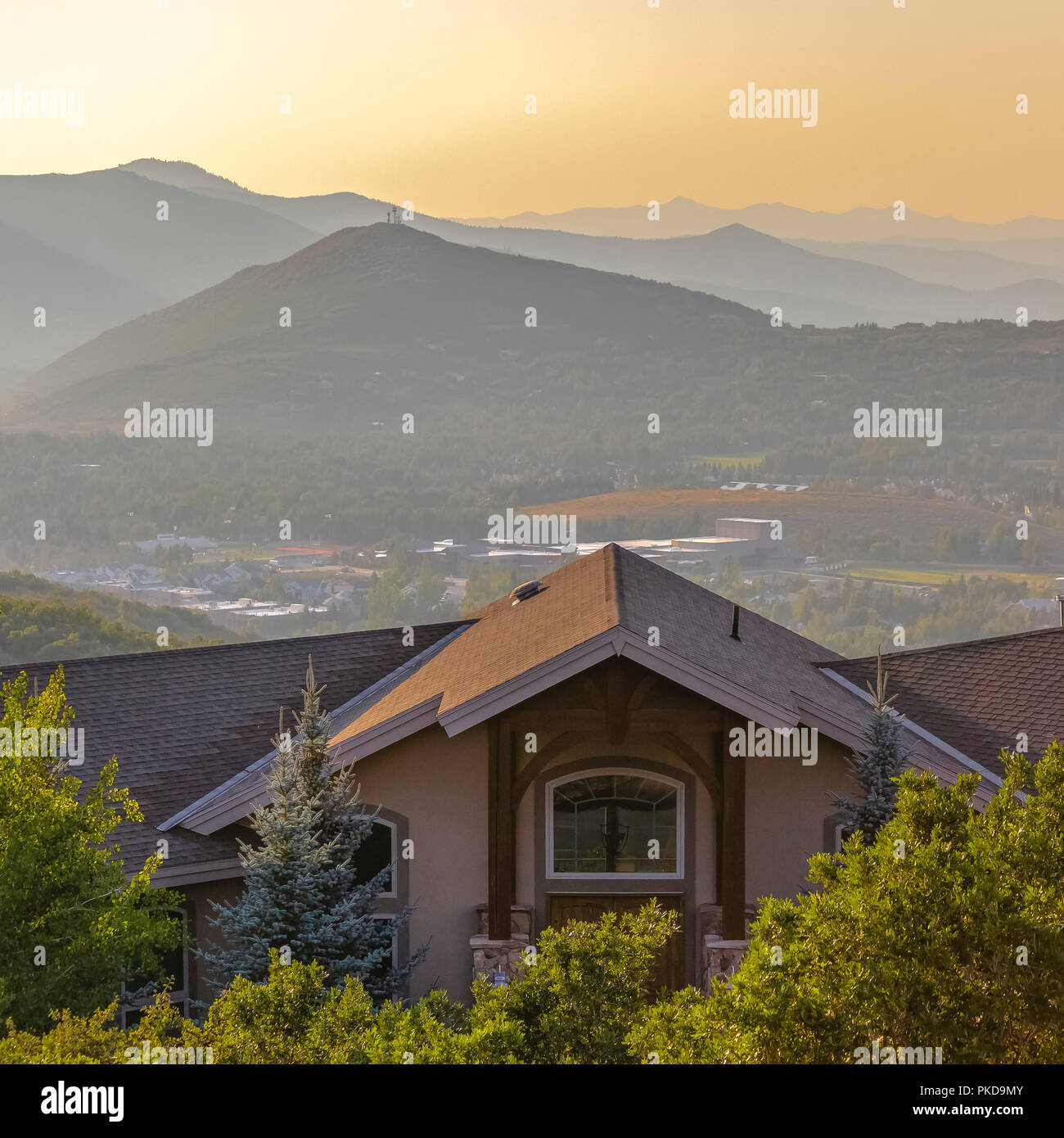 Beatiful homes with the valley behind square Stock Photo - Alamy