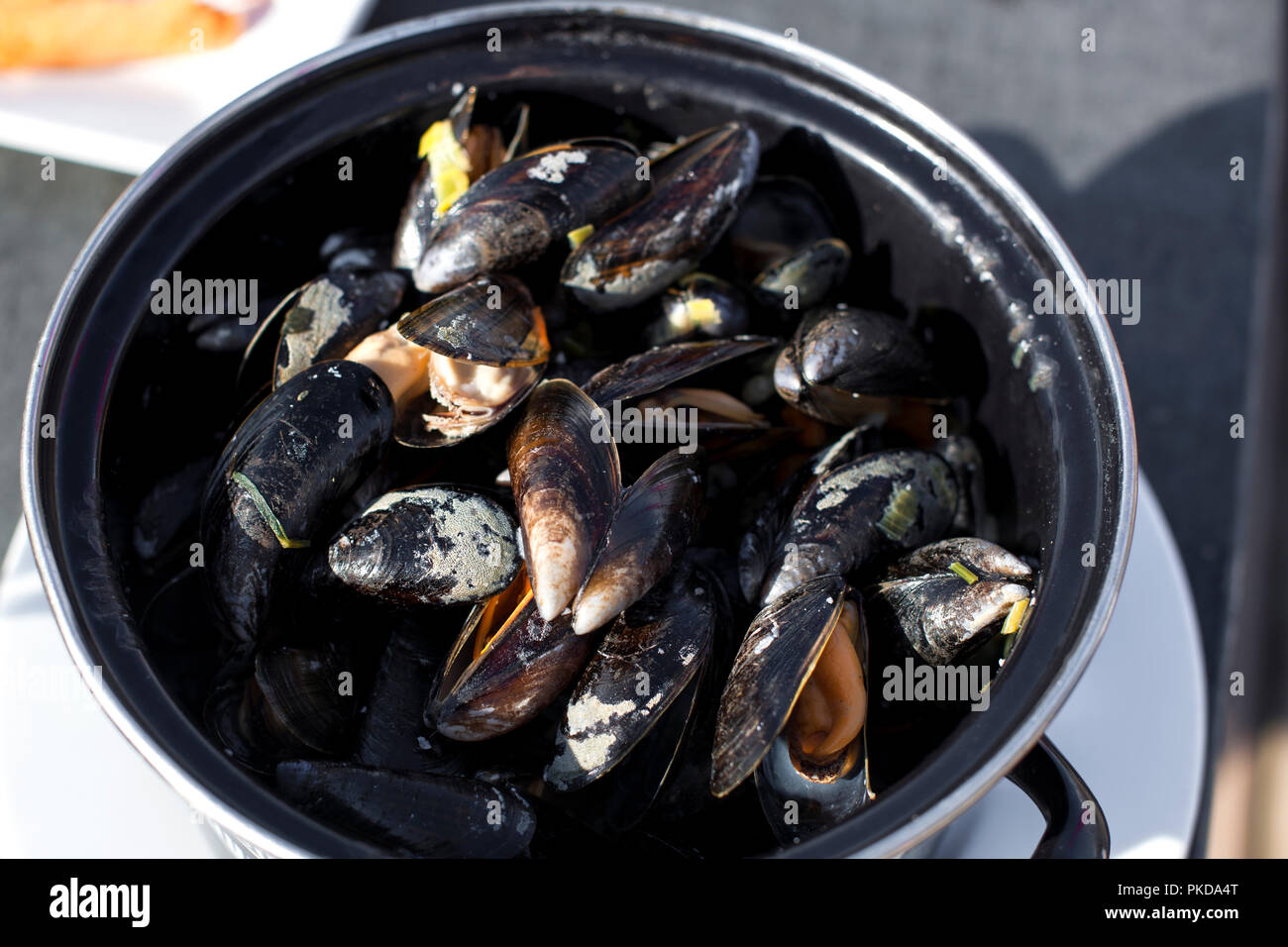Mussels in a saucepan in a restaurant. Delicious seafood dinner. Top ...