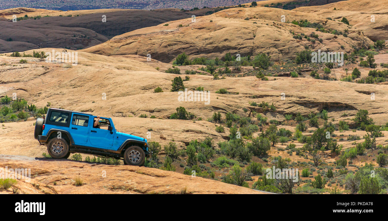 Blue vehicle on a rugged terrain in Moab, Utah Stock Photo - Alamy
