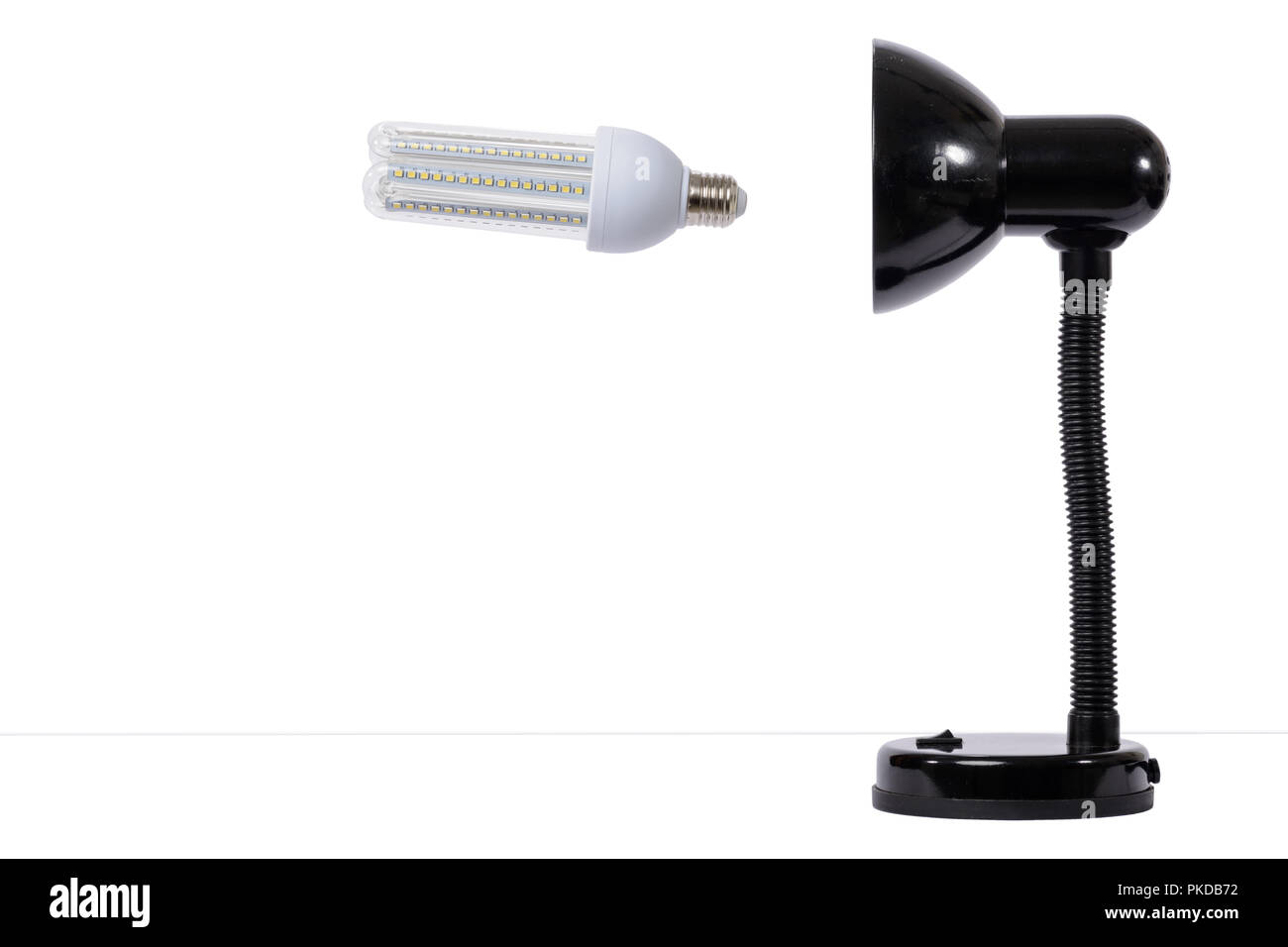 Led lamp in off position with black lamp holder. White background Stock ...