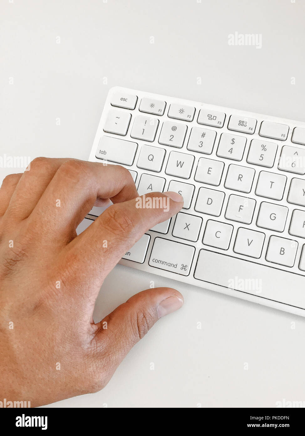 Hand typing on keyboard Stock Photo - Alamy