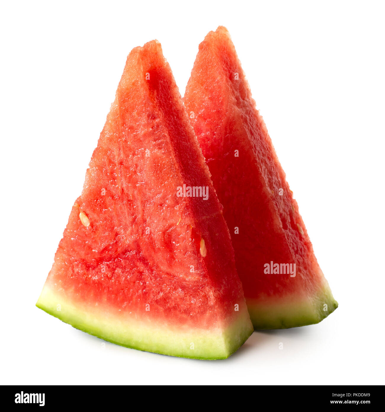 Two standing triangles of seedless watermelon isolated on white Stock ...