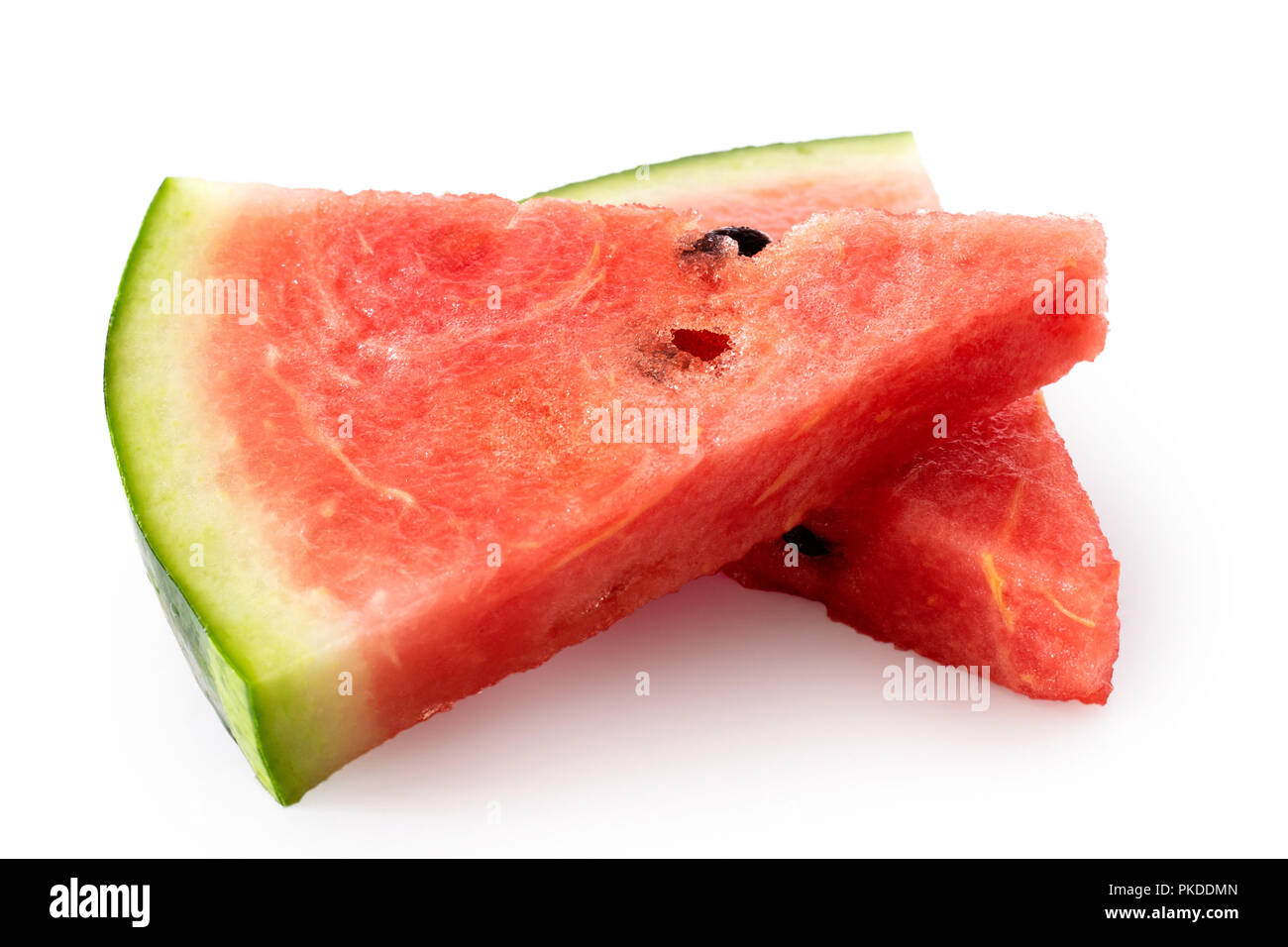 Two lying watermelon triangles with seeds isolated on white Stock Photo ...