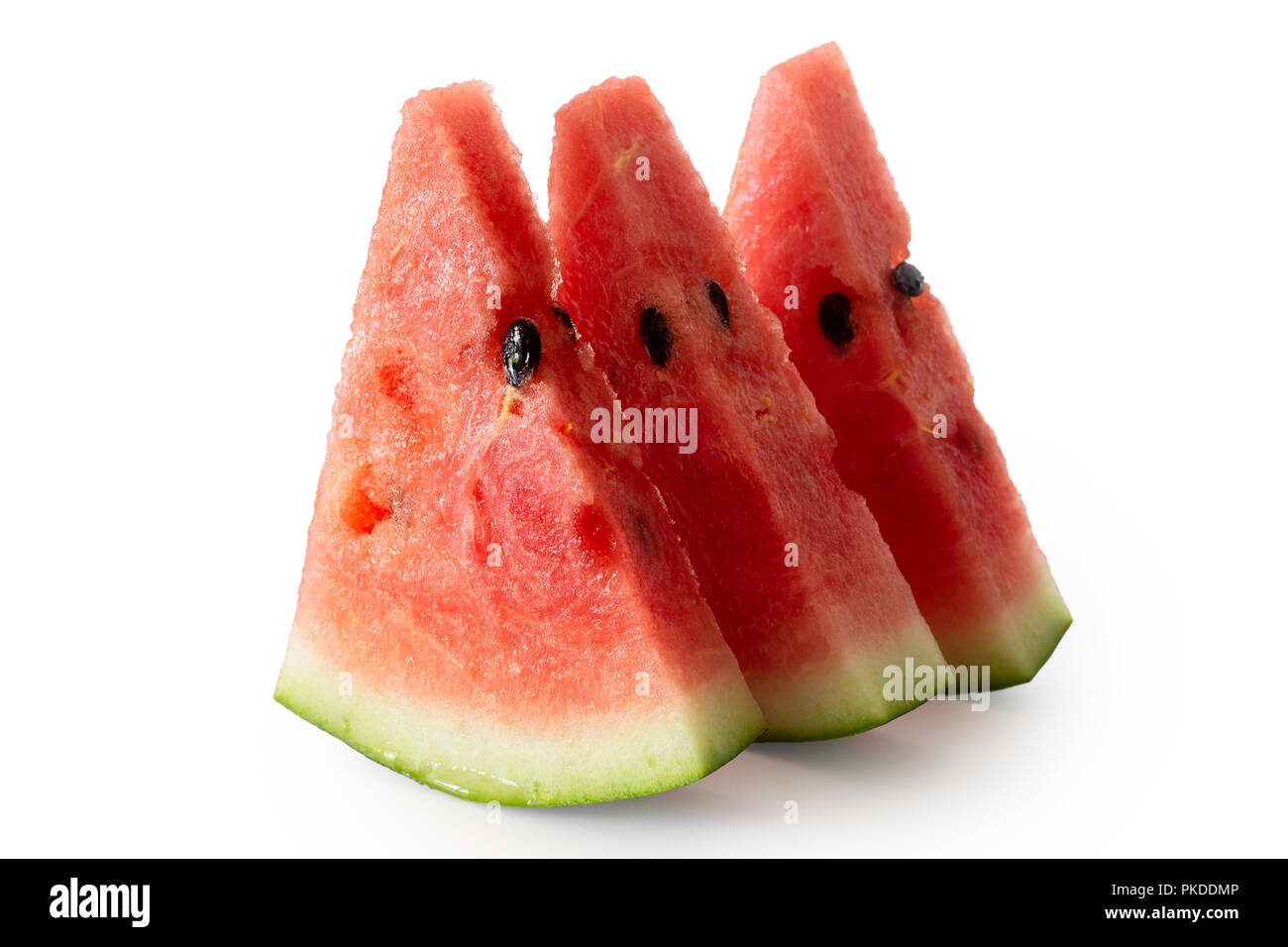 Three standing watermelon triangles with seeds isolated on white Stock ...