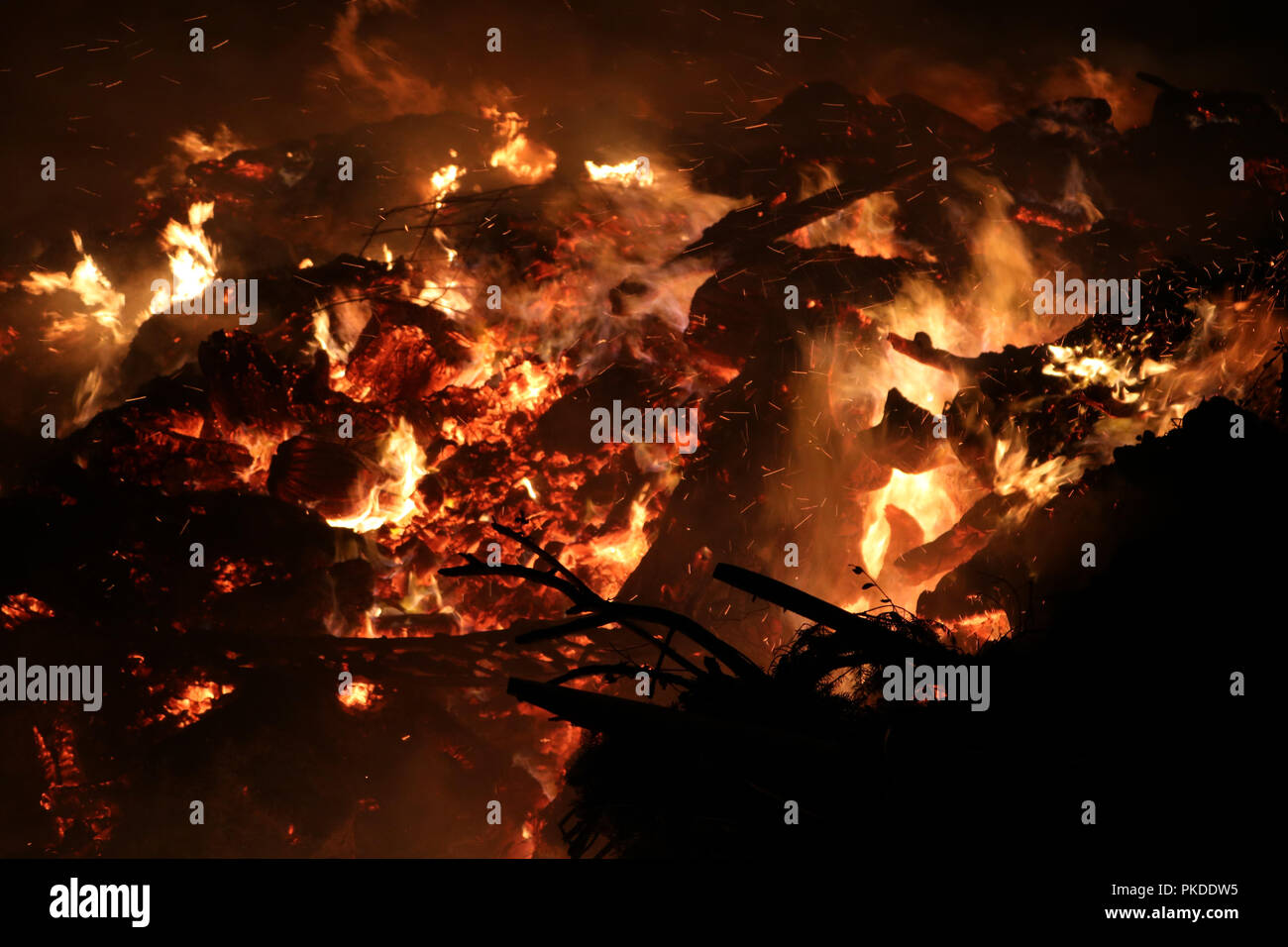 Extreme closeup of roaring fire with sparks showering Stock Photo - Alamy