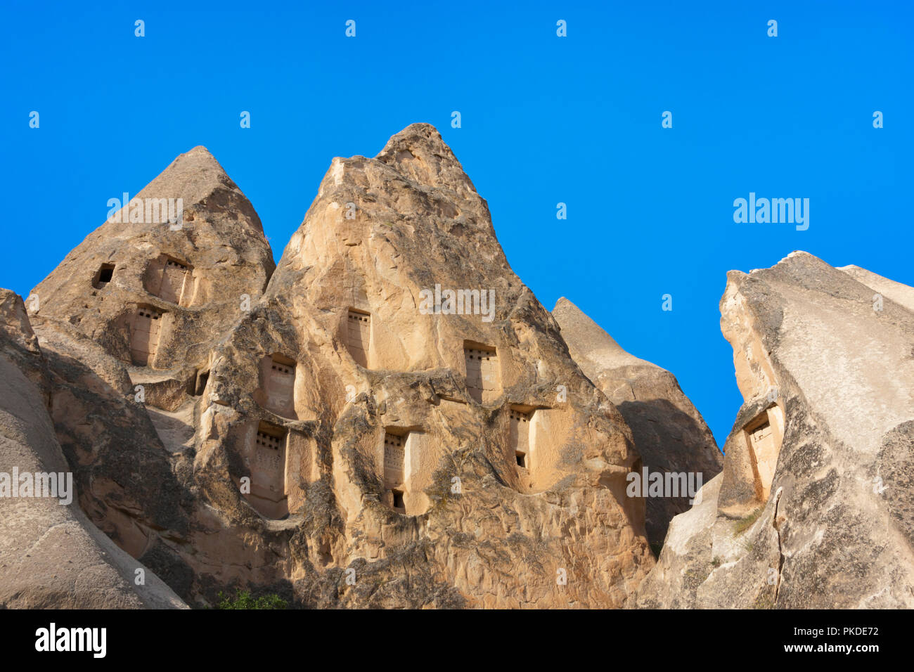 Houses carved into the rock formations in the valley, Goreme ...