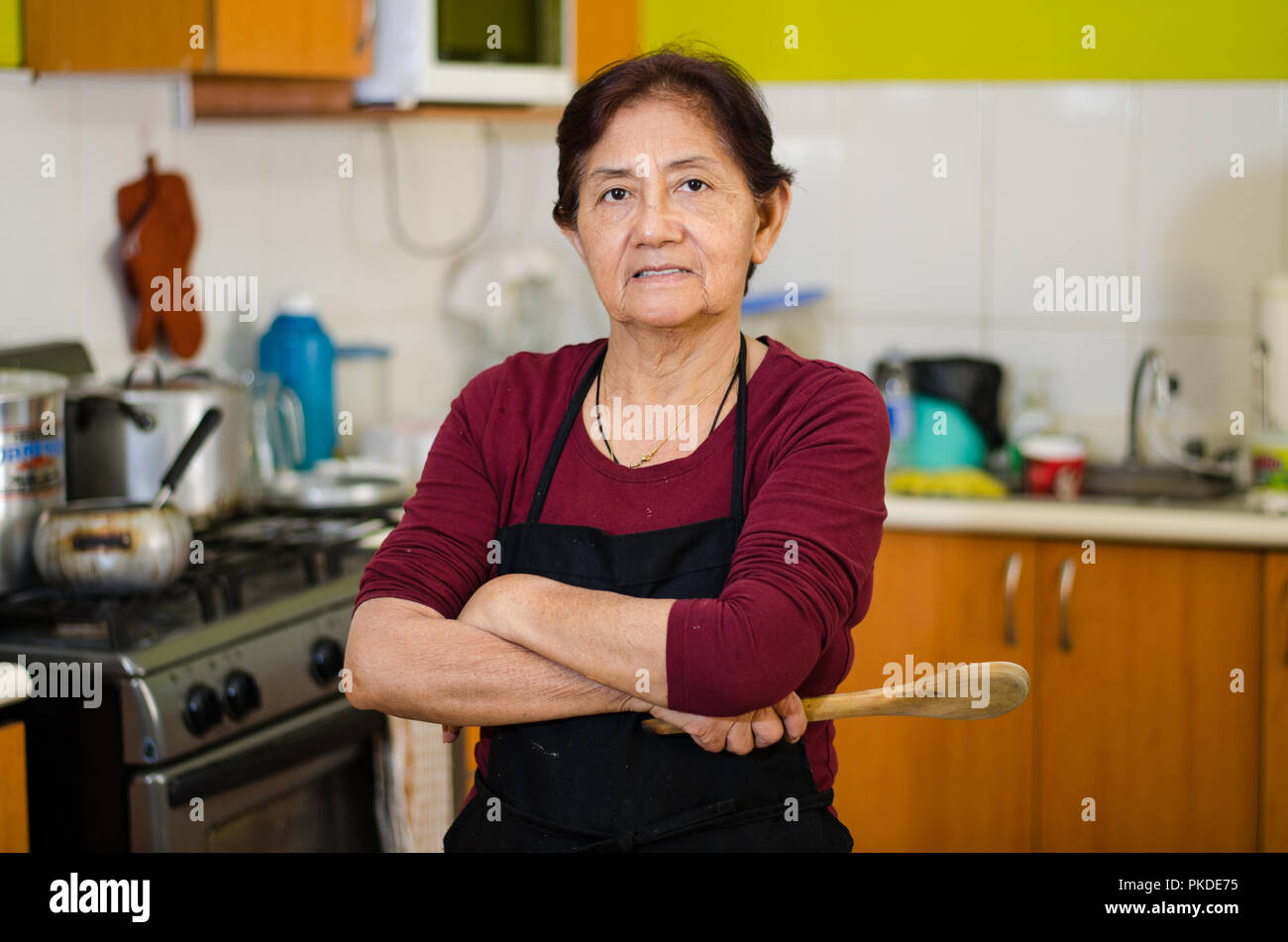 Old lady cooking hi-res stock photography and images - Alamy