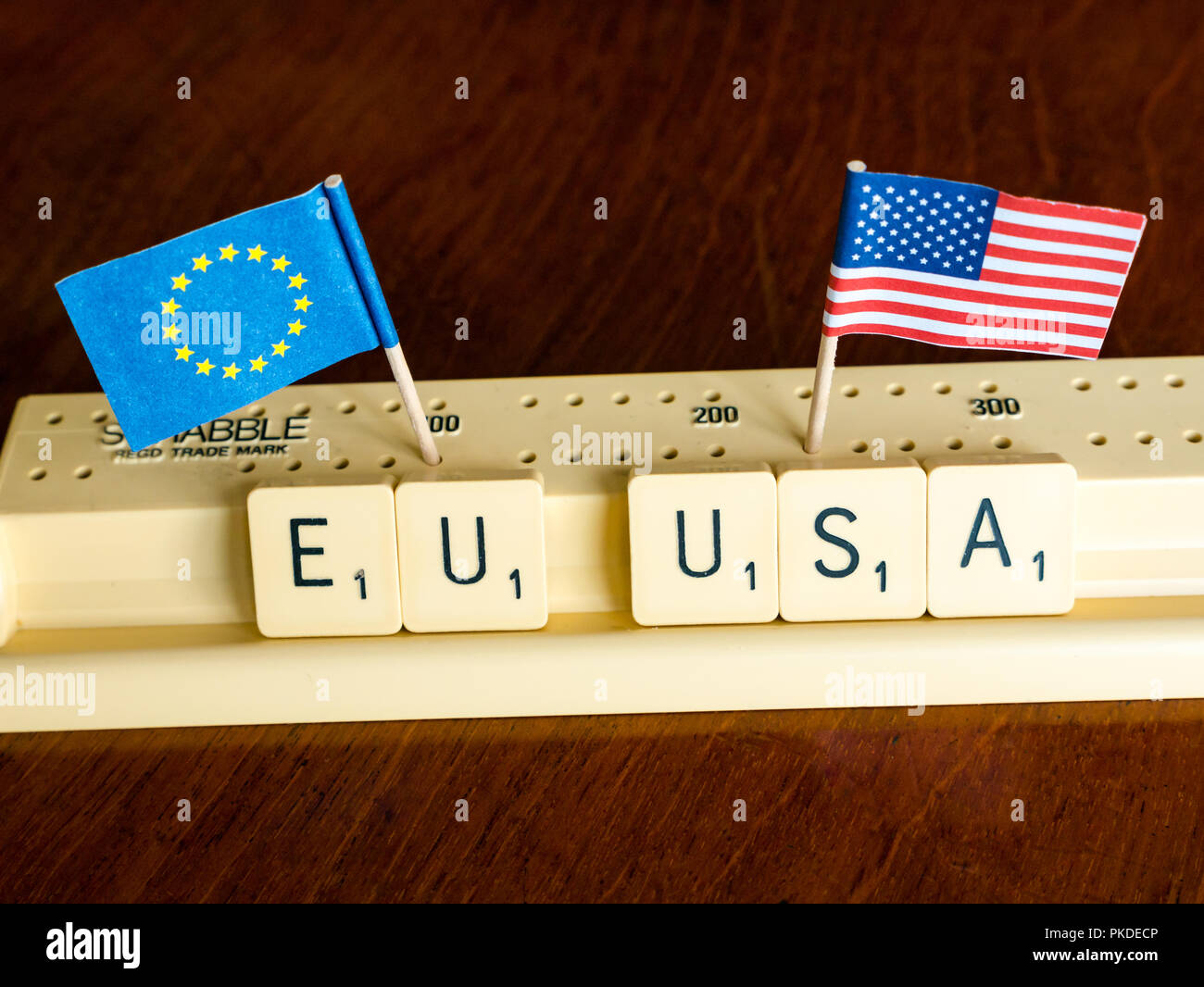 Scrabble letters spelling EU and USA with American and European Union ...
