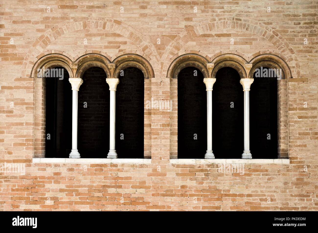 Medieval windows with round arches - Roman style details (Fiastra Abbey ...