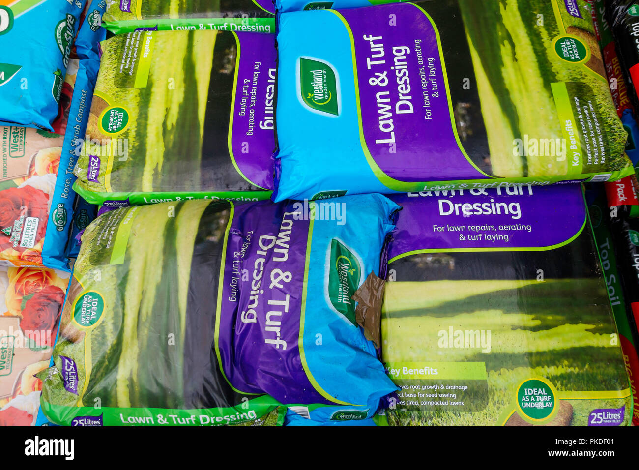 A stack of bags of Westland Lawn and Turf Dressing for feeding grass ...